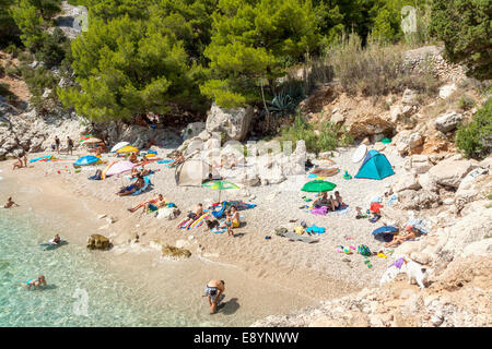 Tourists on Lucisca beach near Sveta Nedilja village, Hvar island ...
