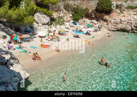 Tourists on Lucisca beach near Sveta Nedilja village, Hvar island ...
