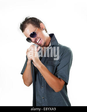 Young male singer recording voice in mic at music studio Stock Photo ...