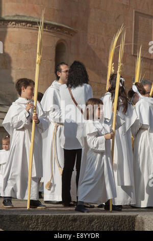 The robed priest of a Catholic church in Laguna Niguel, CA, performs ...