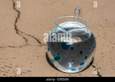 Pouring Squash into Glass of Water close up with a white background ...