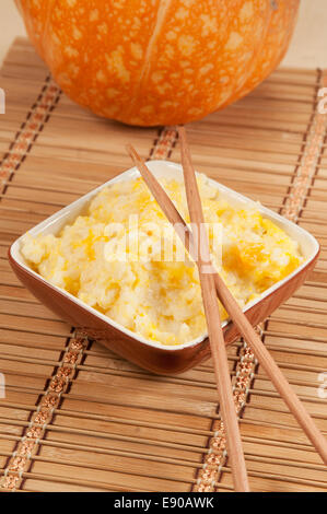 Rice kasha with pumpkin in a ceramic bowl Stock Photo - Alamy