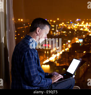 Man looking over city Stock Photo - Alamy