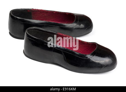 Pair of black rubber overshoe waterproof galoshes isolated on white ...