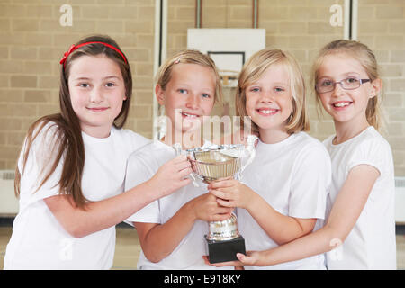 Female School Sports Team In Gym With Basketball Stock Photo - Alamy