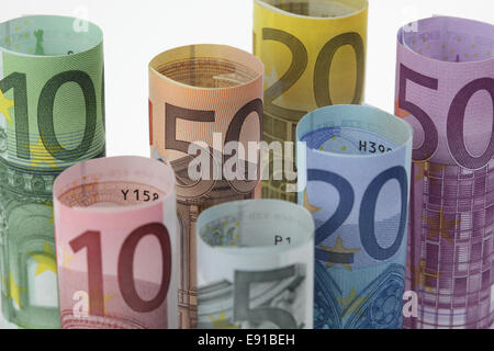 rolled up euro bills on white background Stock Photo - Alamy
