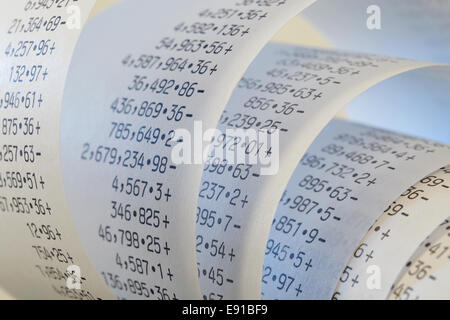 Calculator with adding machine tape, closeup Stock Photo - Alamy