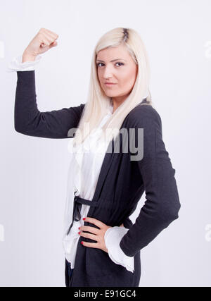 Young expressive blond woman in glasses surfing smartphone and looking ...