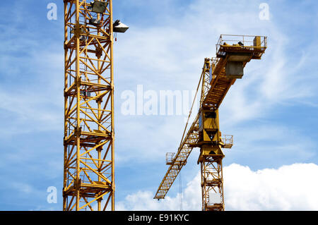 Two large steel construction cranes close together Stock Photo - Alamy