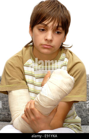 Unhappy boy broken arm Stock Photo - Alamy