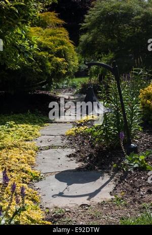 A pathway leading through a lush landscape Stock Photo - Alamy