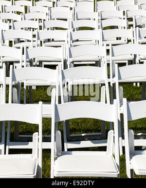 Multiple white folding chairs for event. Outdoor city wedding Stock ...