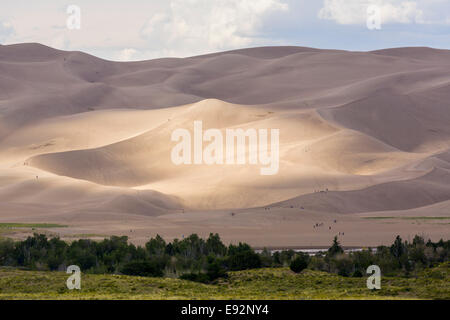People walking in the sand dunes by Rubjerg Knude Lighthouse (Rubjerg ...