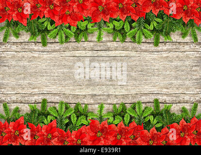 Red poinsettia flower and twigs of Christmas tree with satin ribbons ...