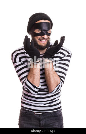 Sad criminal with handcuffs. Portrait isolated on white background ...