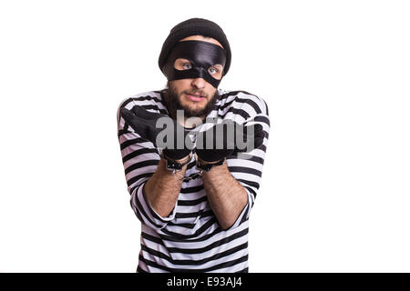 Sad thief with handcuffs. Portrait isolated on white background Stock ...