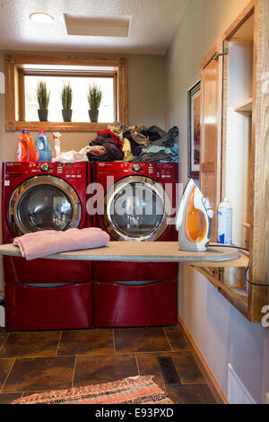 Modern residential laundry room interior Stock Photo - Alamy