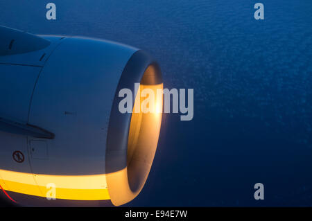 Porthole view out of a ryanair plane window in flight shows summer sky ...