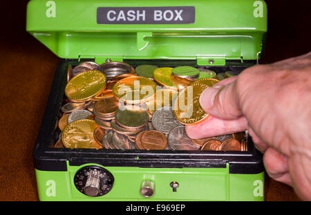 Gold box and gold coins Stock Photo - Alamy