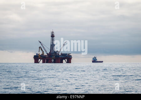 The semi-submersible oil drilling rig Ocean Guardian alongside ...