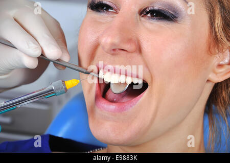Dental anesthesia, beautiful young woman getting injection before ...