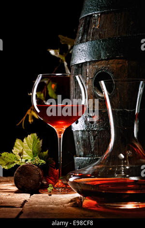Decanter with red wine and old wooden barrel with copy space Stock ...
