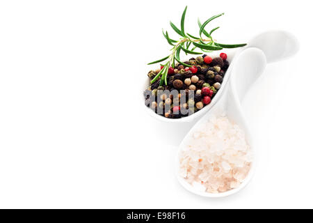 A black bowl filled with coarse white crystals sits on a blue wooden ...