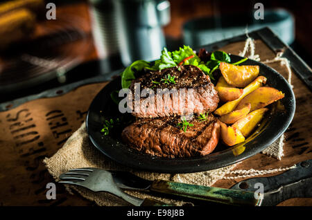 Healthy lean grilled medium-rare steak and vegetables Stock Photo - Alamy