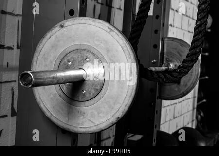Barbells in a gym bar bells and rope at cross fit Stock Photo - Alamy