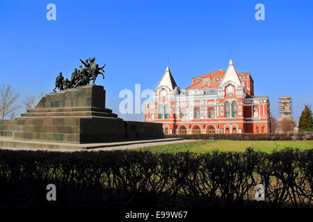 Town landscape with historic theater and blue sky Stock Photo - Alamy