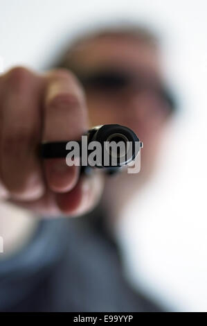muzzle of a pointed pistol Stock Photo - Alamy