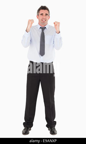 Young businessman with the fists up Stock Photo - Alamy