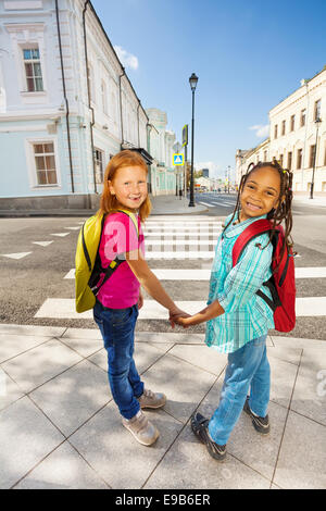 happy girls hold hands Stock Photo - Alamy