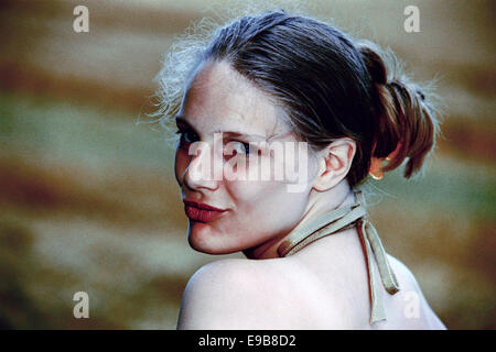 young female aspiring model poses for portfolio photographs during the ...