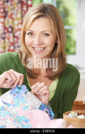 Portrait Of Woman Sewing Quilt Stock Photo - Alamy