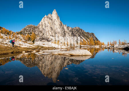 Prusik Peak, Gnome Tarn and alpine larch trees at sunrise; The ...