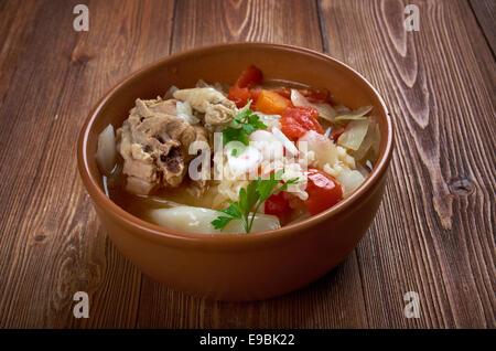 chicken posole garnished with carrots, tomato and radish Stock Photo ...