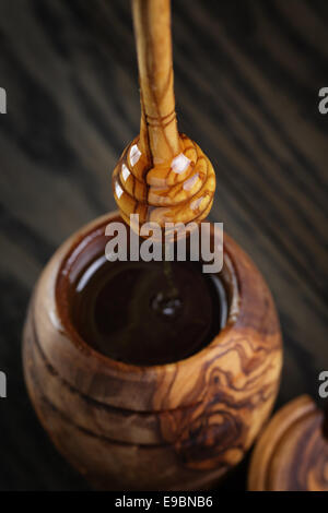 maple honey flowing from dipper to pot, rustic style Stock Photo - Alamy