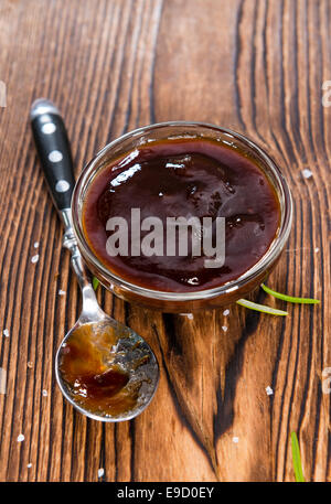 Barbeque Sauce with Tomatoes, Smoked Salt and fresh Herbs (on rustic ...