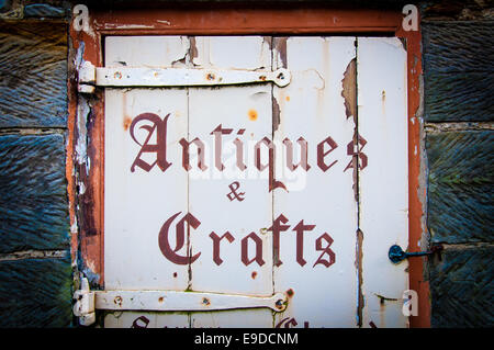Old wooden Obsolete sign with Antiques and Crafts Stock Photo - Alamy
