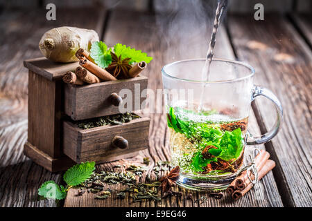Brewing green tea with cinnamon Stock Photo - Alamy