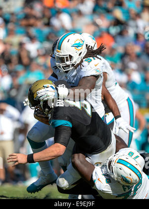 Miami Dolphins defensive end Terrence Fede (78) embraces Jacksonville ...