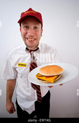 A fast food worker dressed up as an order of chicken nuggets walks down ...