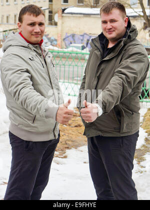 two young guys stand on the pier Stock Photo - Alamy