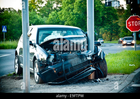 Broken lamp post after car accident. Freeze morning with slippery ...