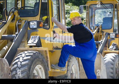 Construction workers working on Construction machine. Aerial platform ...