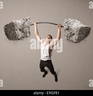 muscular man lifting large rock stone weights Stock Photo - Alamy