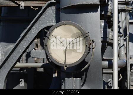 Weathered electrical headlight of a steam locomotive. Electrical bulb ...