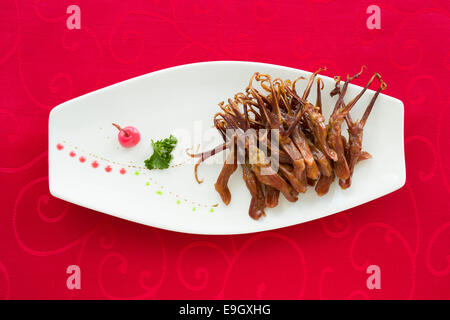 Chinese cuisine braised duck tongues Stock Photo - Alamy
