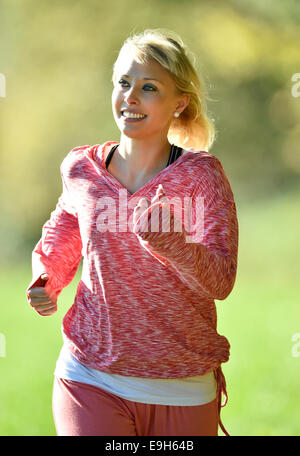 Young woman jogging, Germany Stock Photo - Alamy